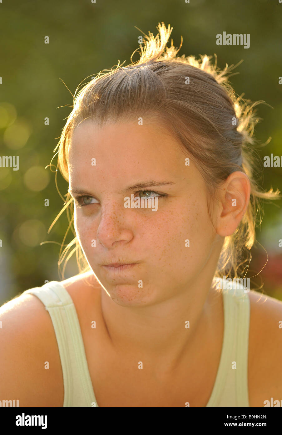 Girl with grim expression Stock Photo - Alamy