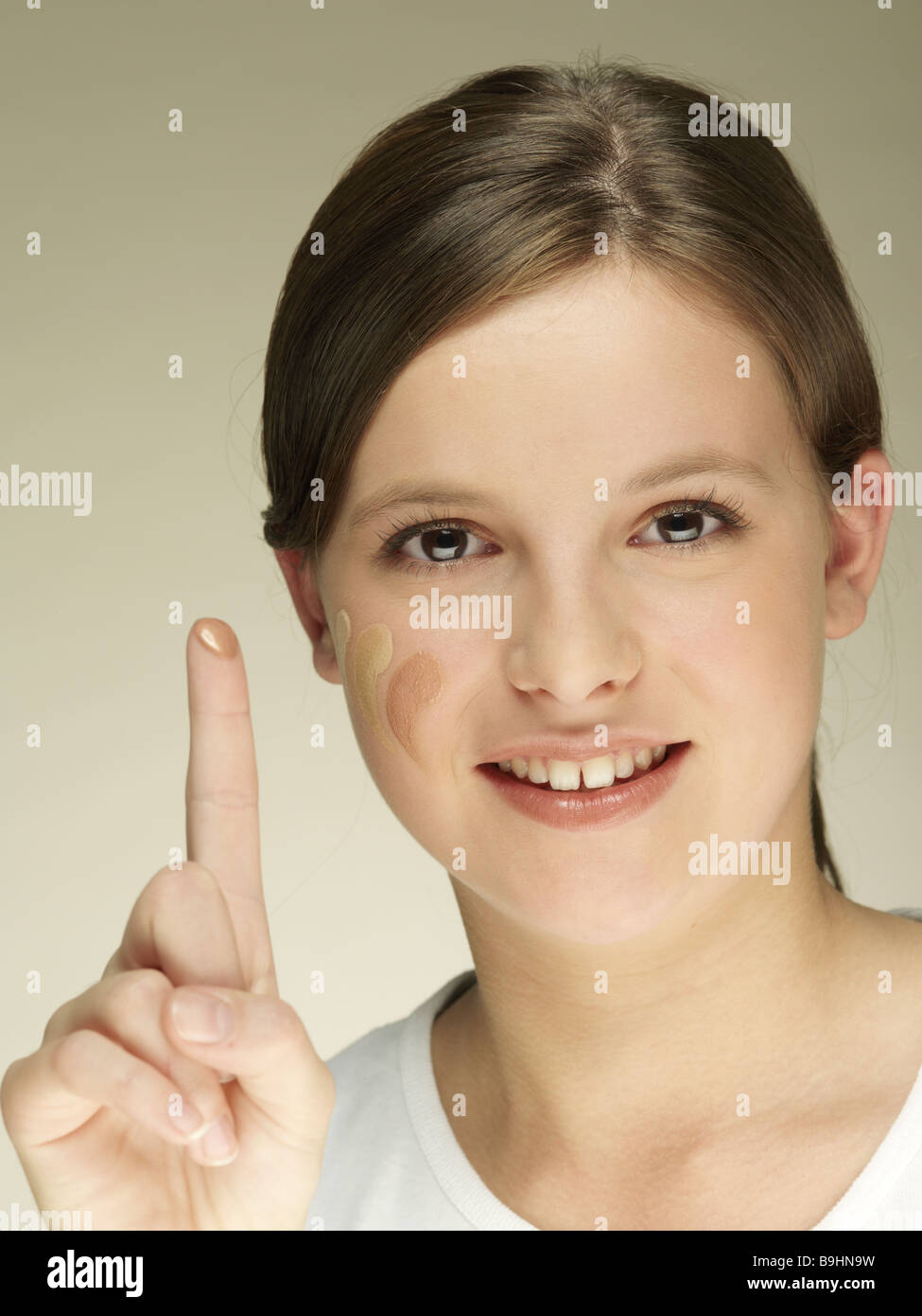Teenagers girl test make up tone makeup gesture index fingers portrait ...