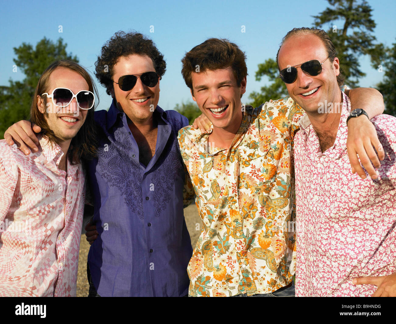 Men smiling at camera Stock Photo - Alamy