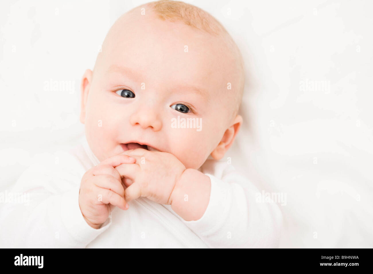 Baby smiling into camera Stock Photo - Alamy