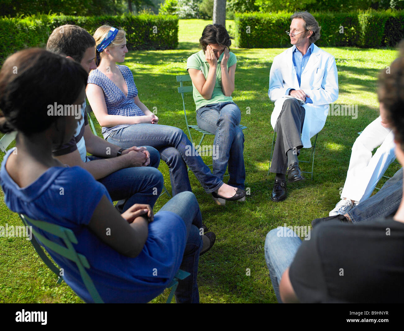 Circle of people, with doctor Stock Photo - Alamy