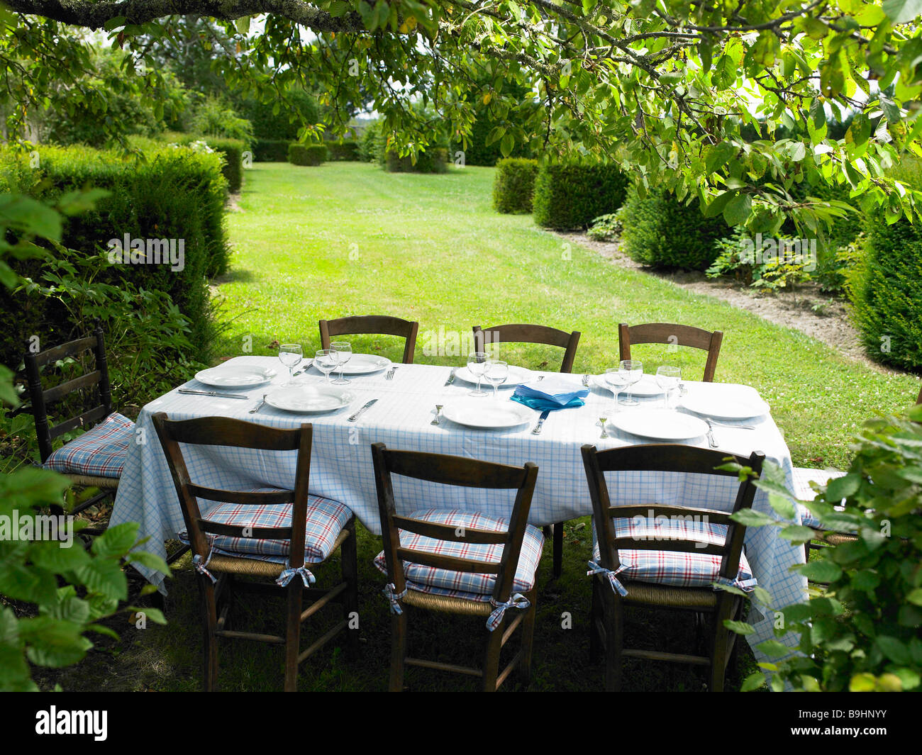 Table set in the garden Stock Photo - Alamy