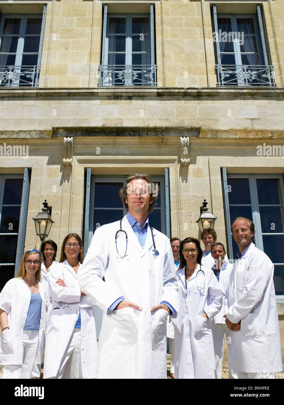 Doctors standing outdoors Stock Photo - Alamy
