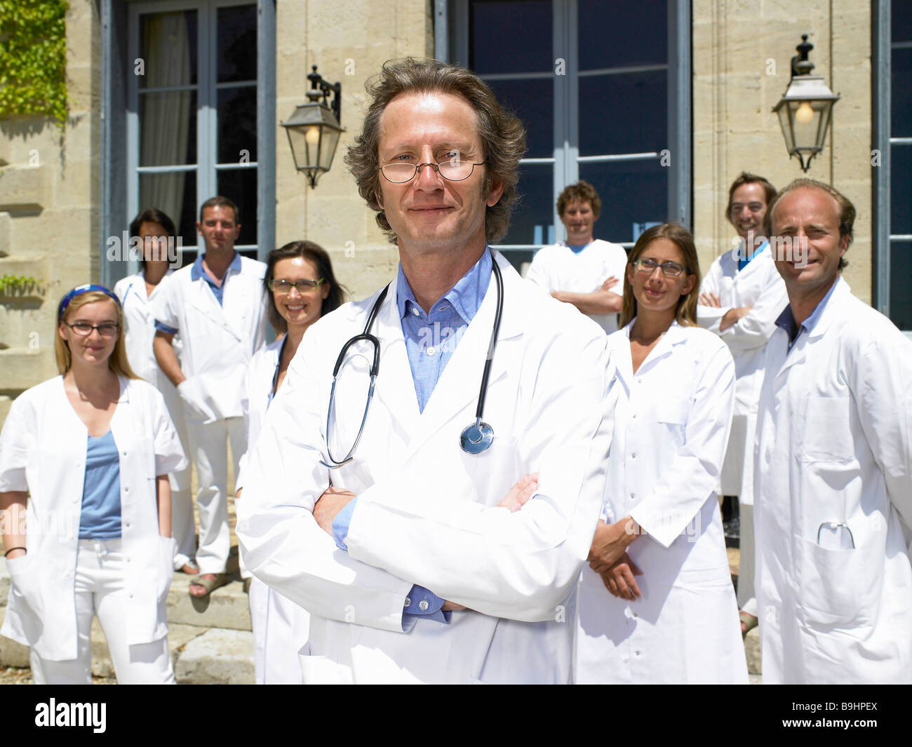 Doctors standing outdoors Stock Photo - Alamy