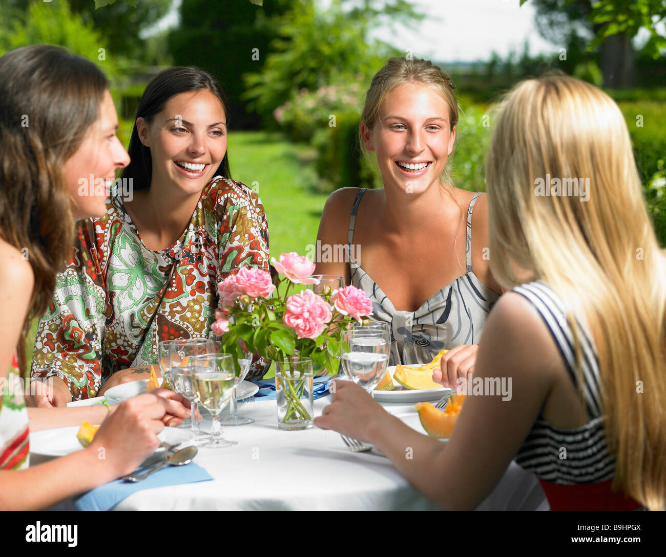 Girlfriends having lunch outdoors Stock Photo - Alamy
