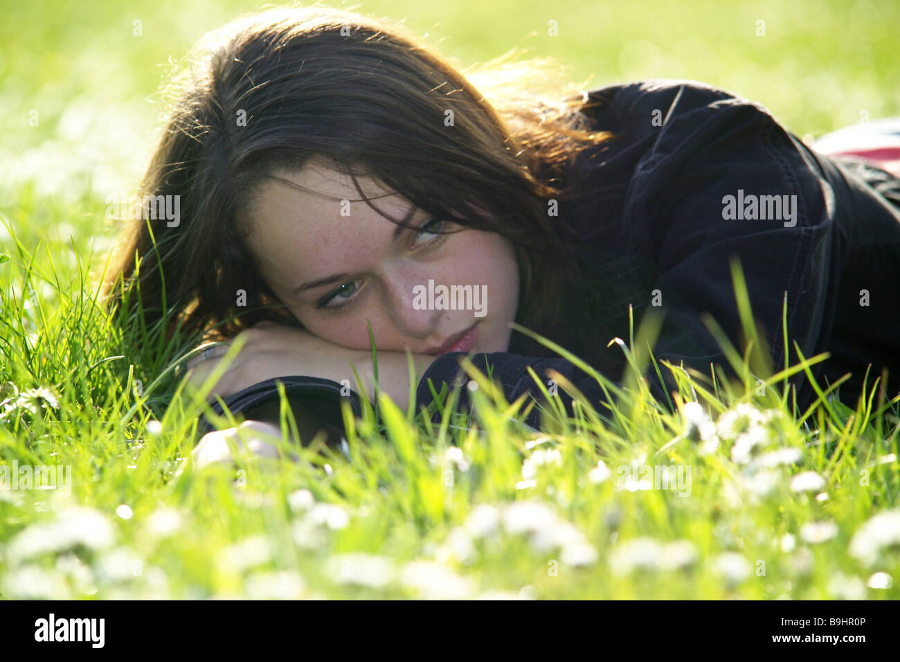 girl meadow lying sorrowfully unfortunately series people teenagers ...