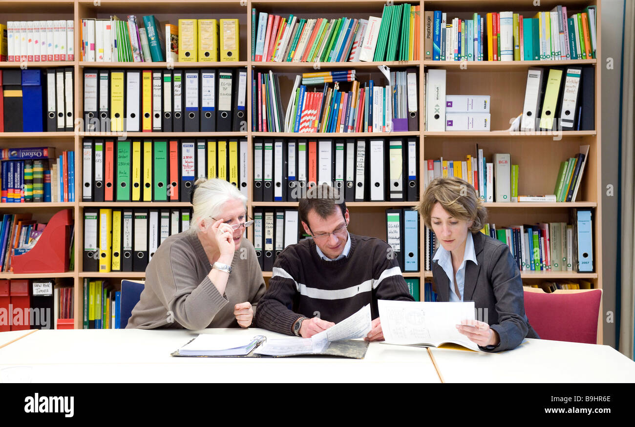 Discussion in a work room Stock Photo - Alamy