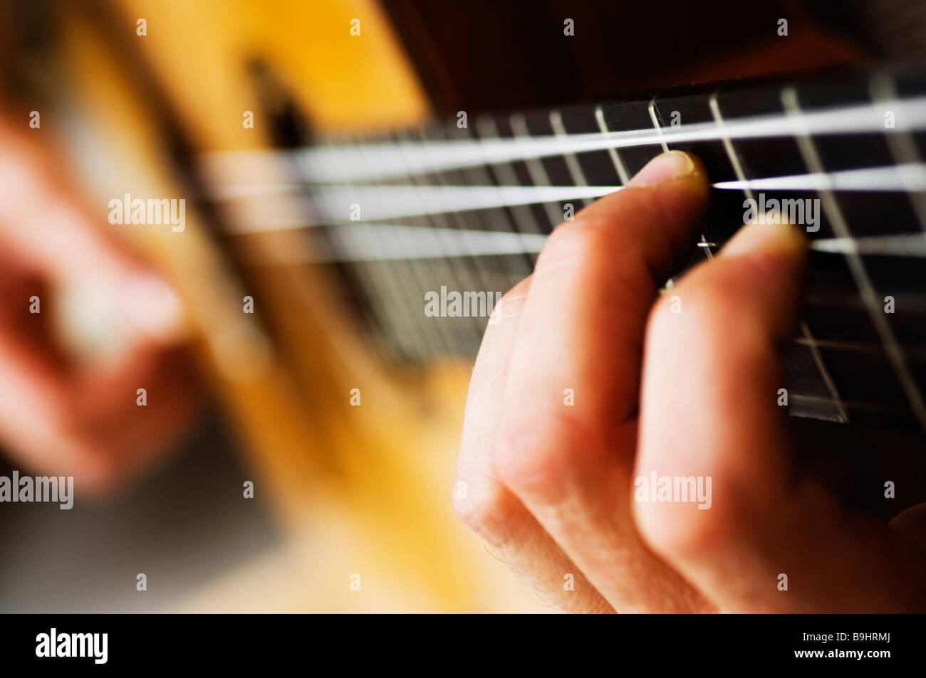 Hand and fingers of a guitarist and detail of a guitar Stock Photo - Alamy