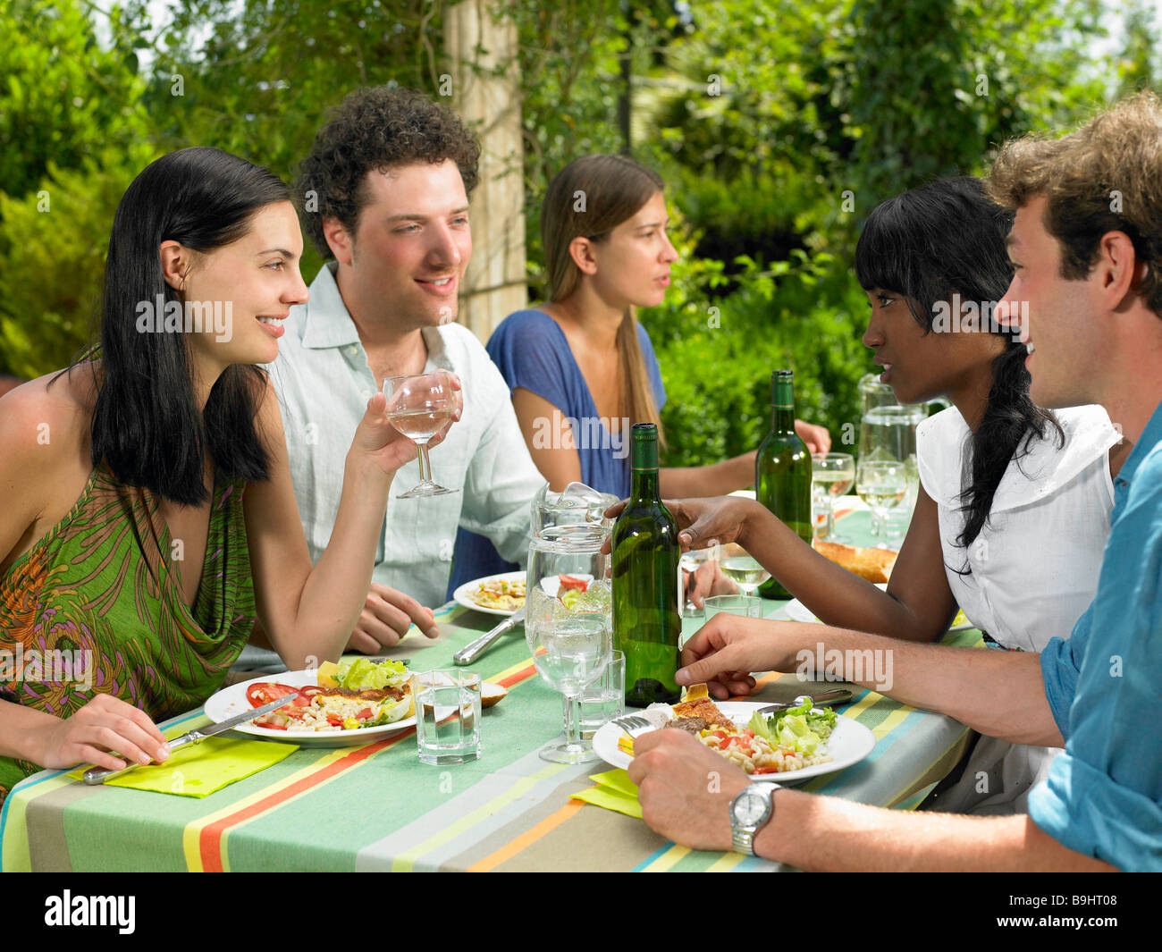 Friends having lunch in the garden Stock Photo - Alamy