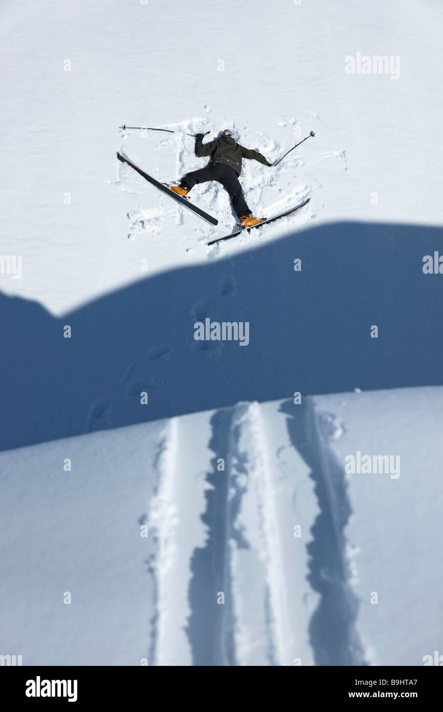Skier head down in snow Stock Photo - Alamy