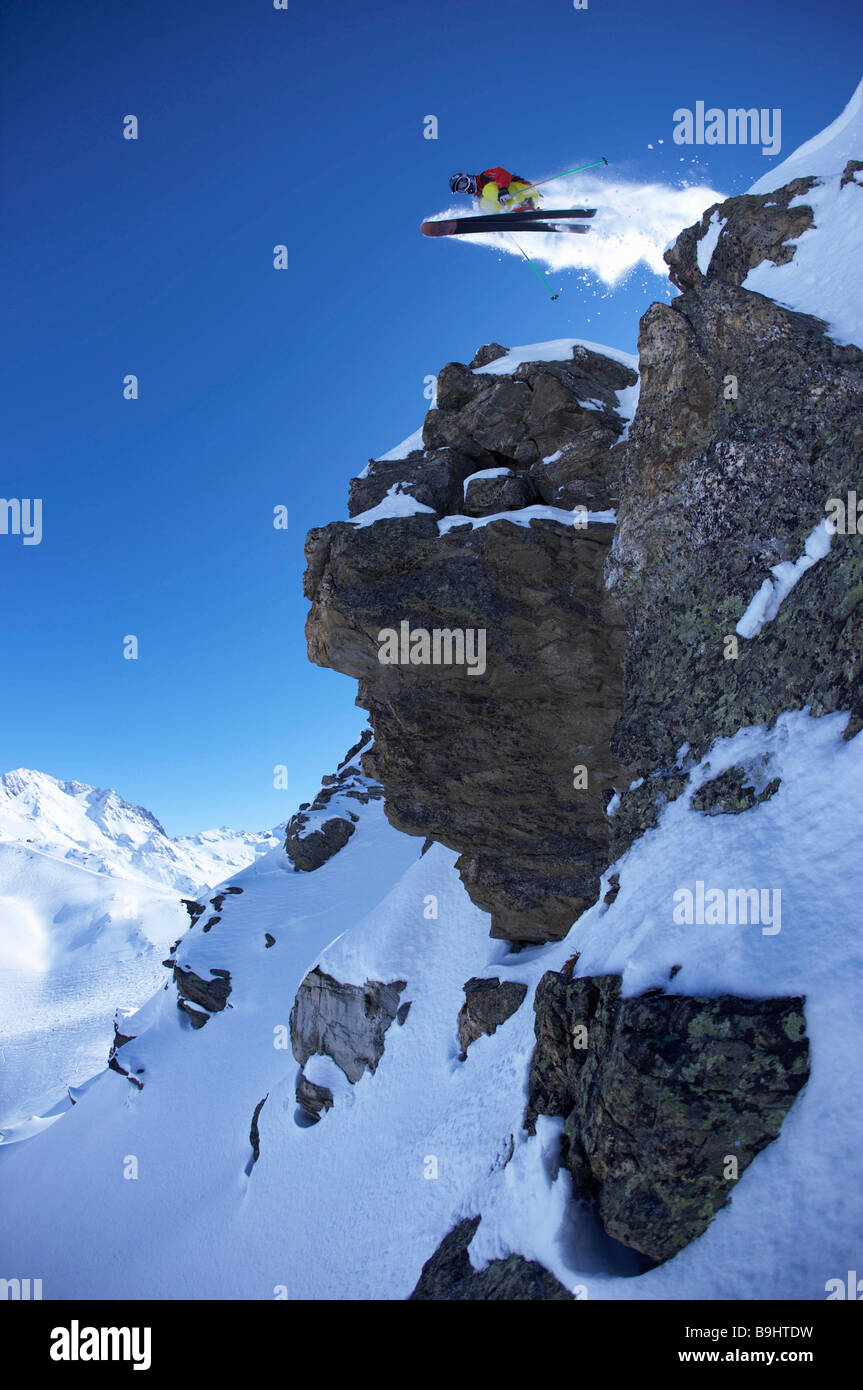 Extreme skier jumping from rock Stock Photo - Alamy