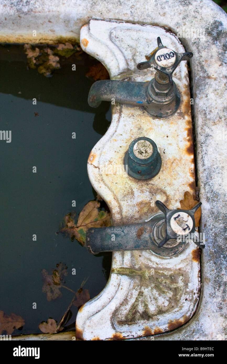 Abandoned bath with taps Stock Photo - Alamy