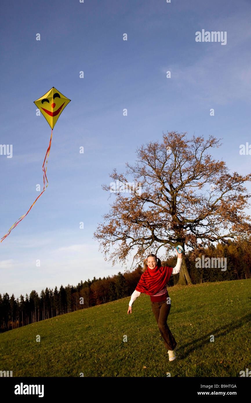 Girl flying a Kite Stock Photo - Alamy
