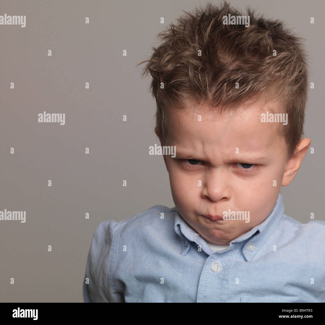 Boy frowning, portrait, close-up Stock Photo - Alamy