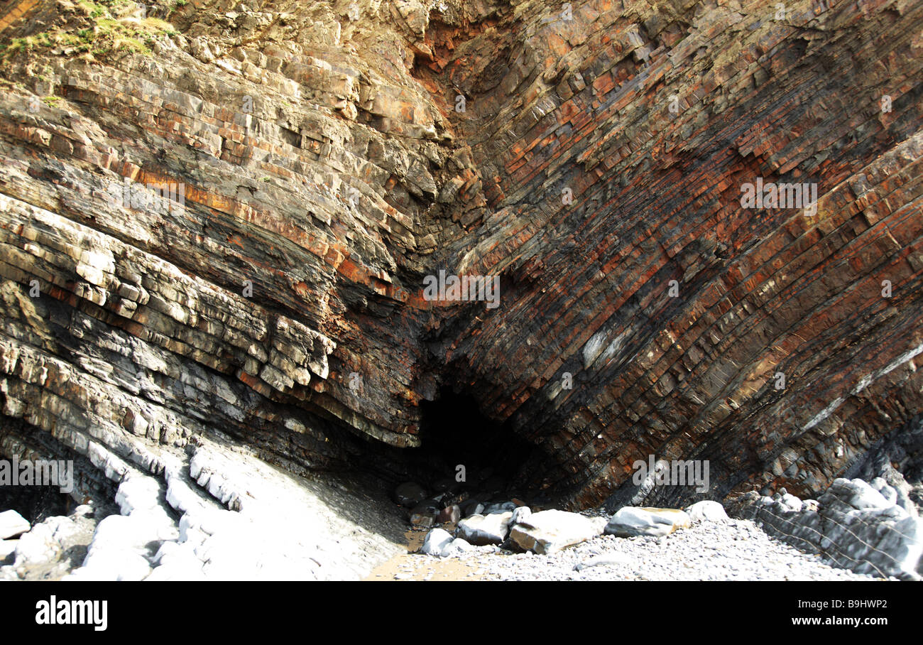 Rock strata and a sea cave in North Devon Stock Photo - Alamy