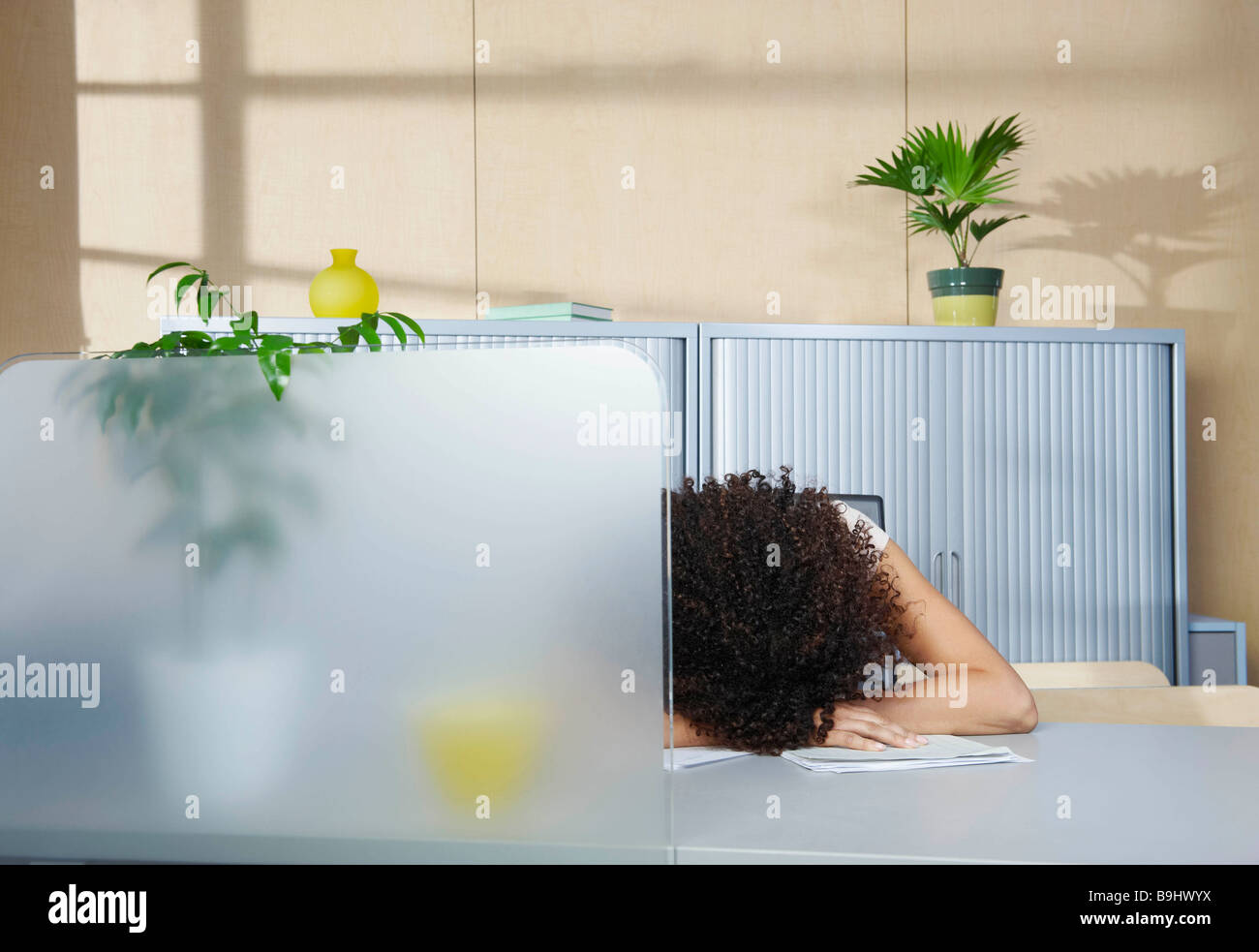 Woman asleep at desk in office Stock Photo - Alamy