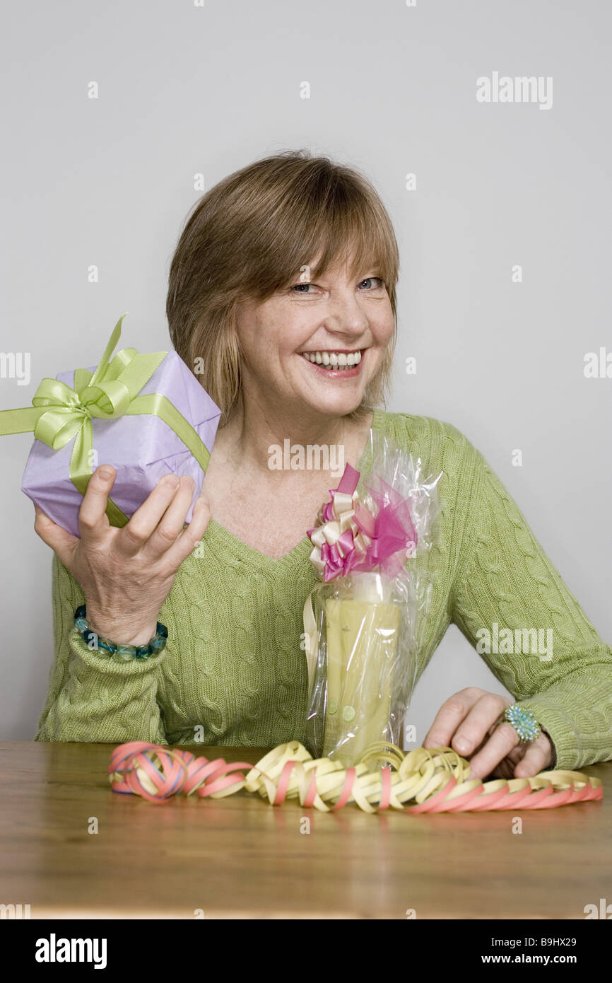 Senior woman gets surprise gift hi-res stock photography and images - Alamy