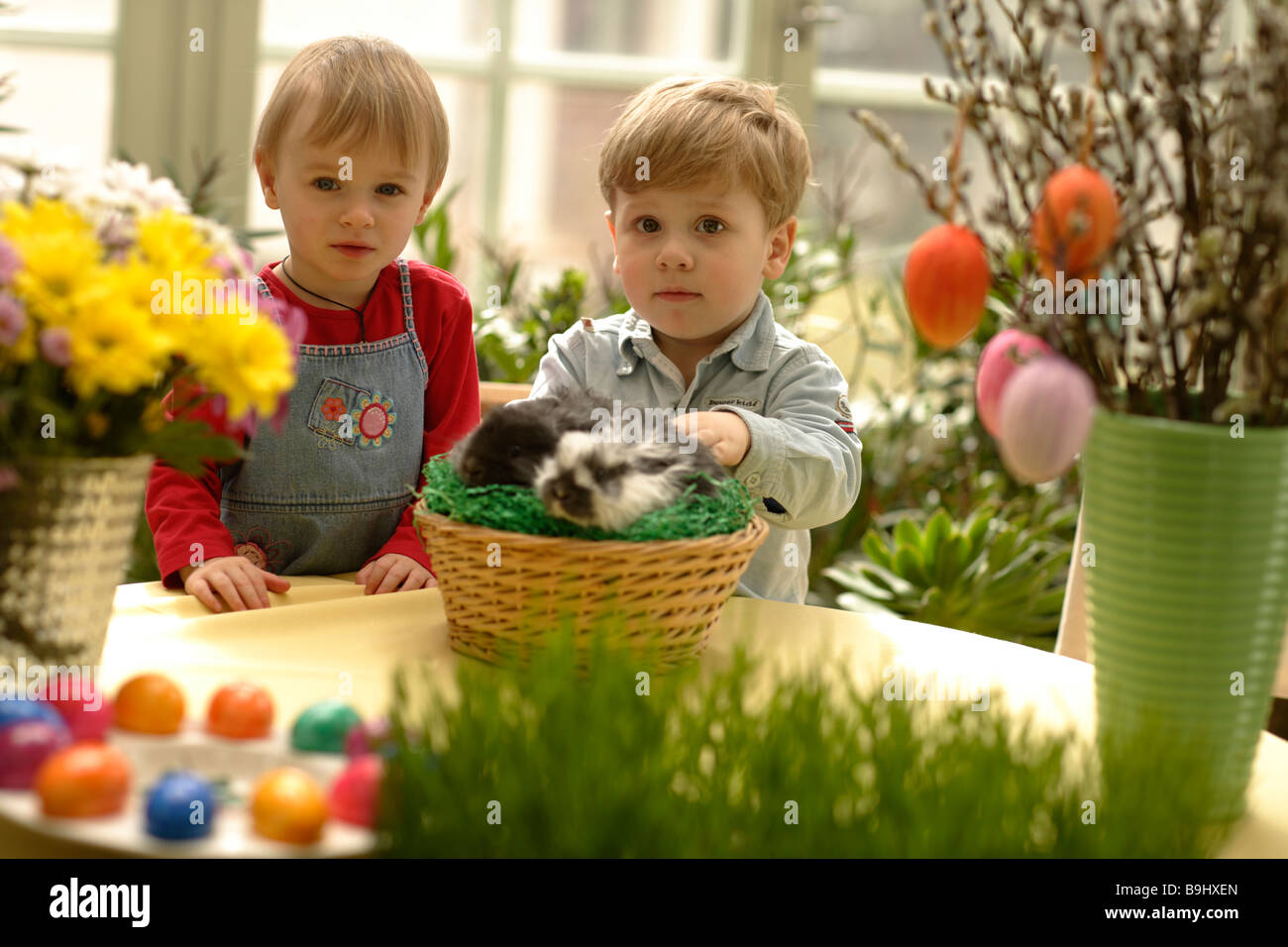 Boy girl easter eggs basket hi-res stock photography and images - Alamy