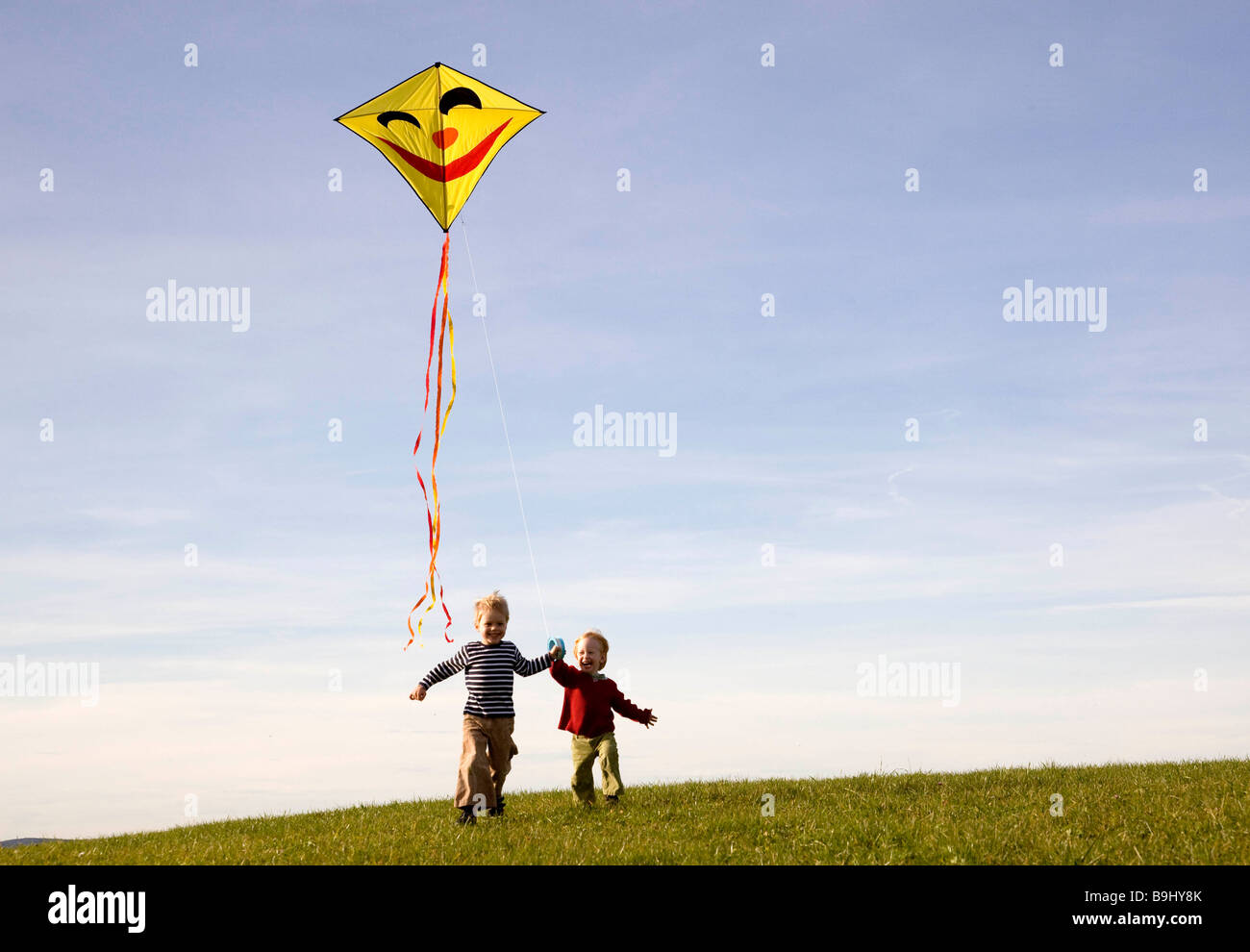 Two boys fly kite hi-res stock photography and images - Alamy