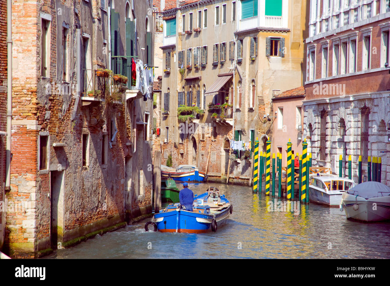 Picturesque small canals in Venice with boats and small bridges Stock ...