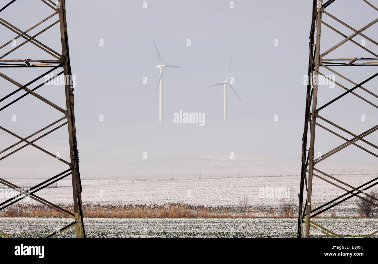 Power poles and wind turbines in fog Stock Photo - Alamy