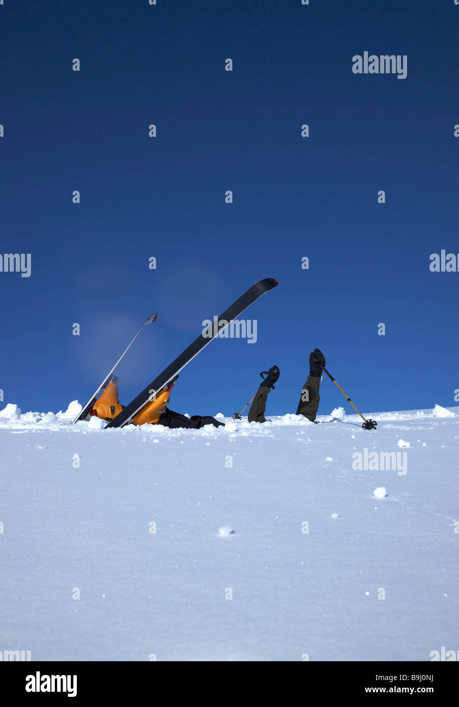 Skier head down in snow Stock Photo - Alamy