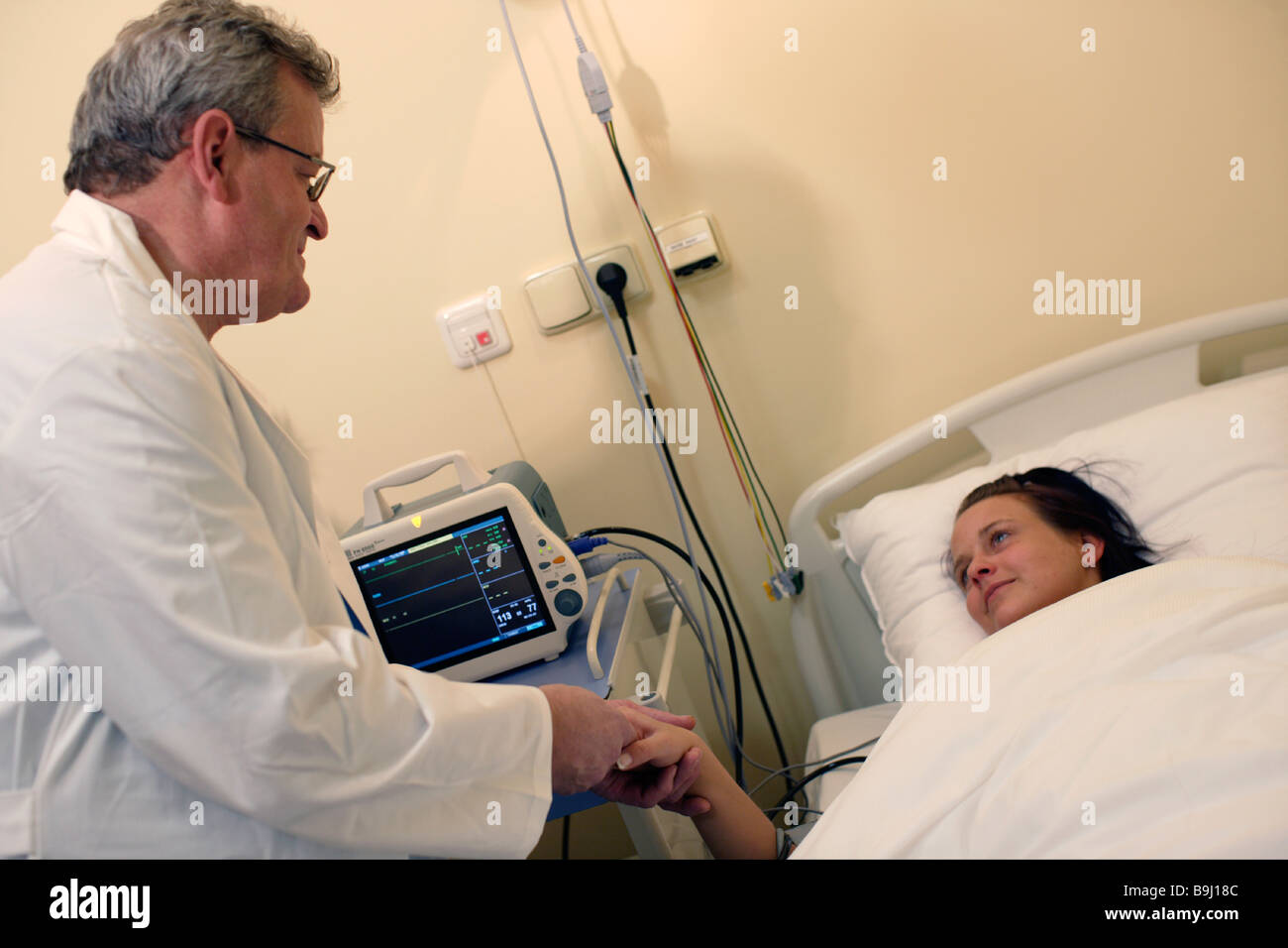 Bedside visit hospital hi-res stock photography and images - Alamy