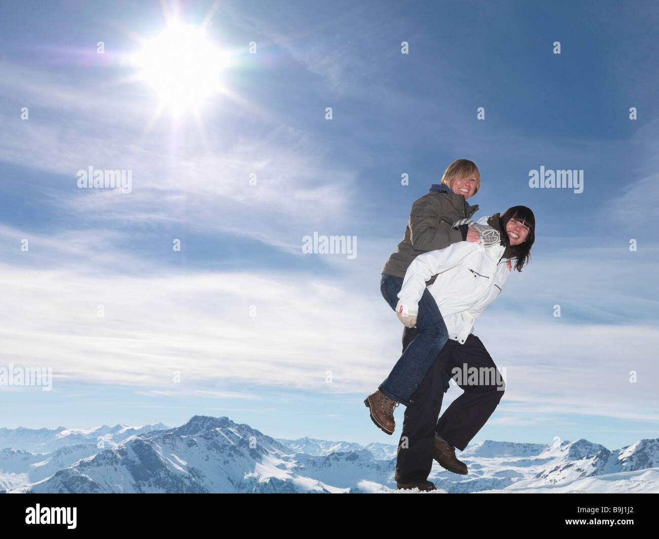 Hikers playing piggyback ride Stock Photo - Alamy