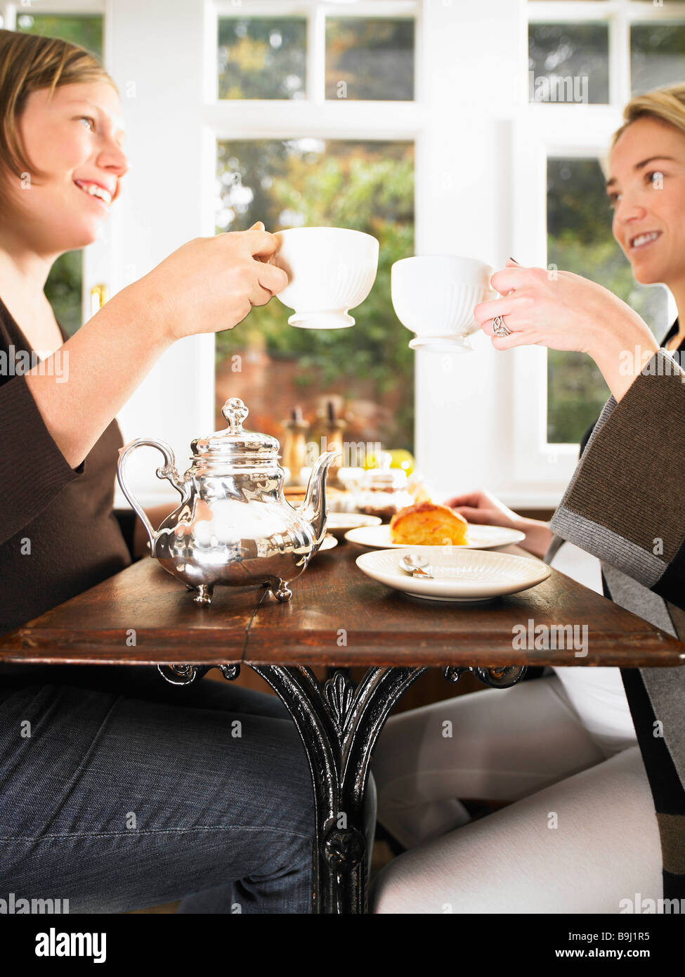Pregnant women having tea Stock Photo - Alamy