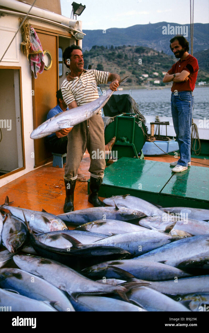 Greece Islands Poros fisherman with tuna fish Stock Photo - Alamy