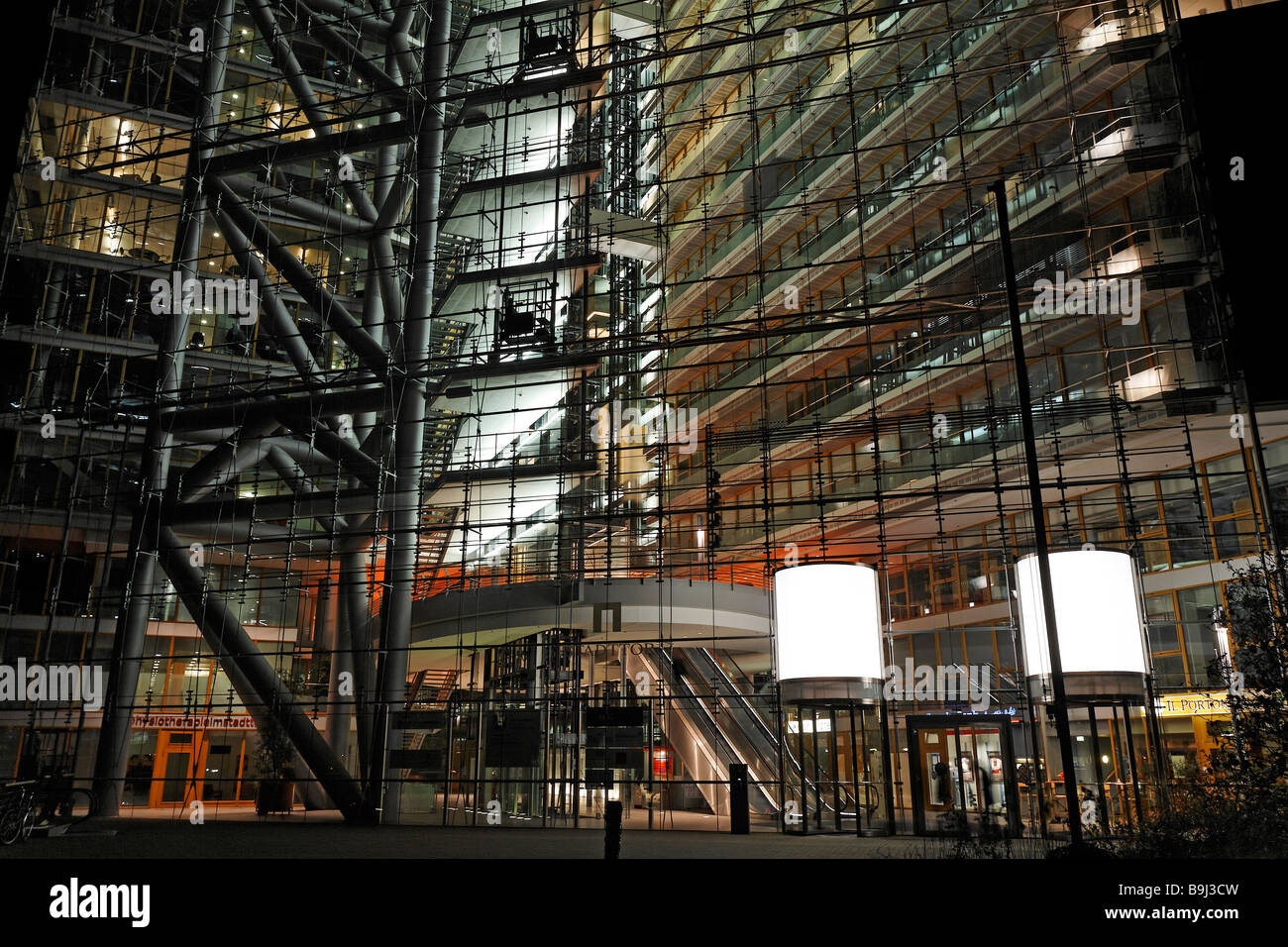 Stadttor office building, glass facade, looking into the illuminated ...