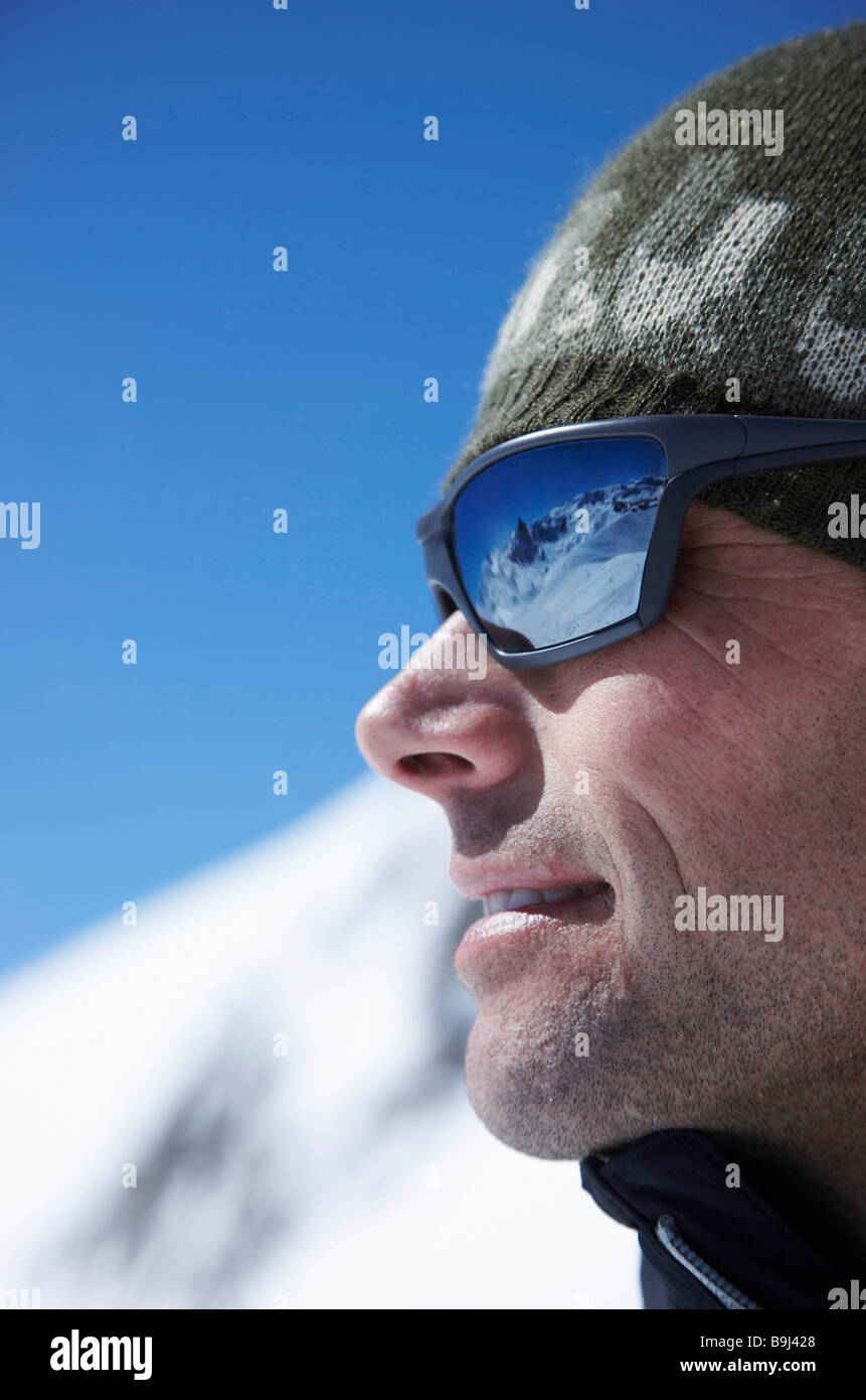 Man wearing sunglasses on mountain Stock Photo - Alamy