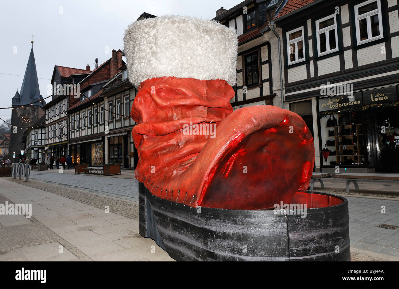 Oversized St. Nicholas boot on the sidewalk, hole in the shoe ...