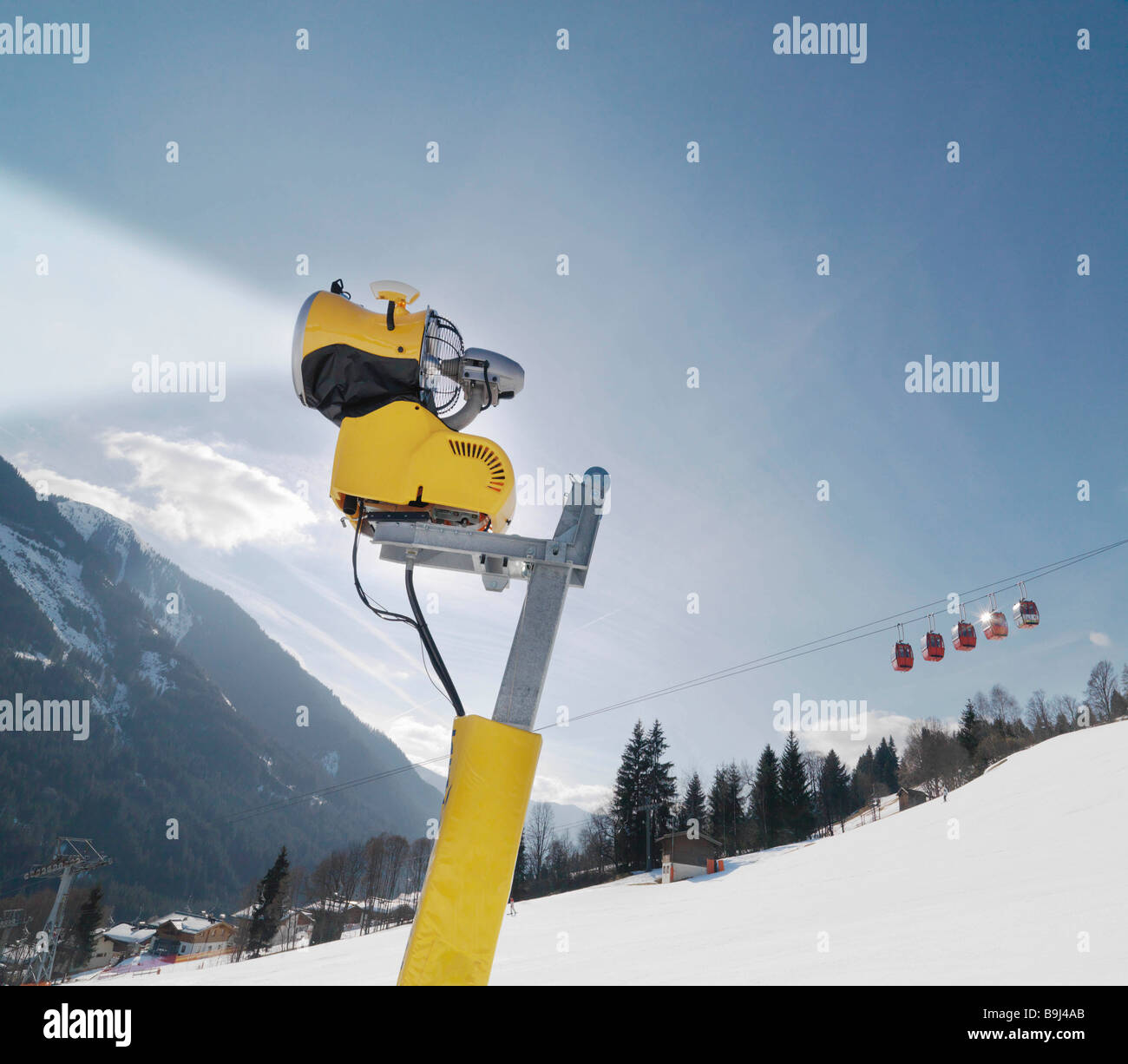 Snowblower and cable car in ski resort Stock Photo - Alamy