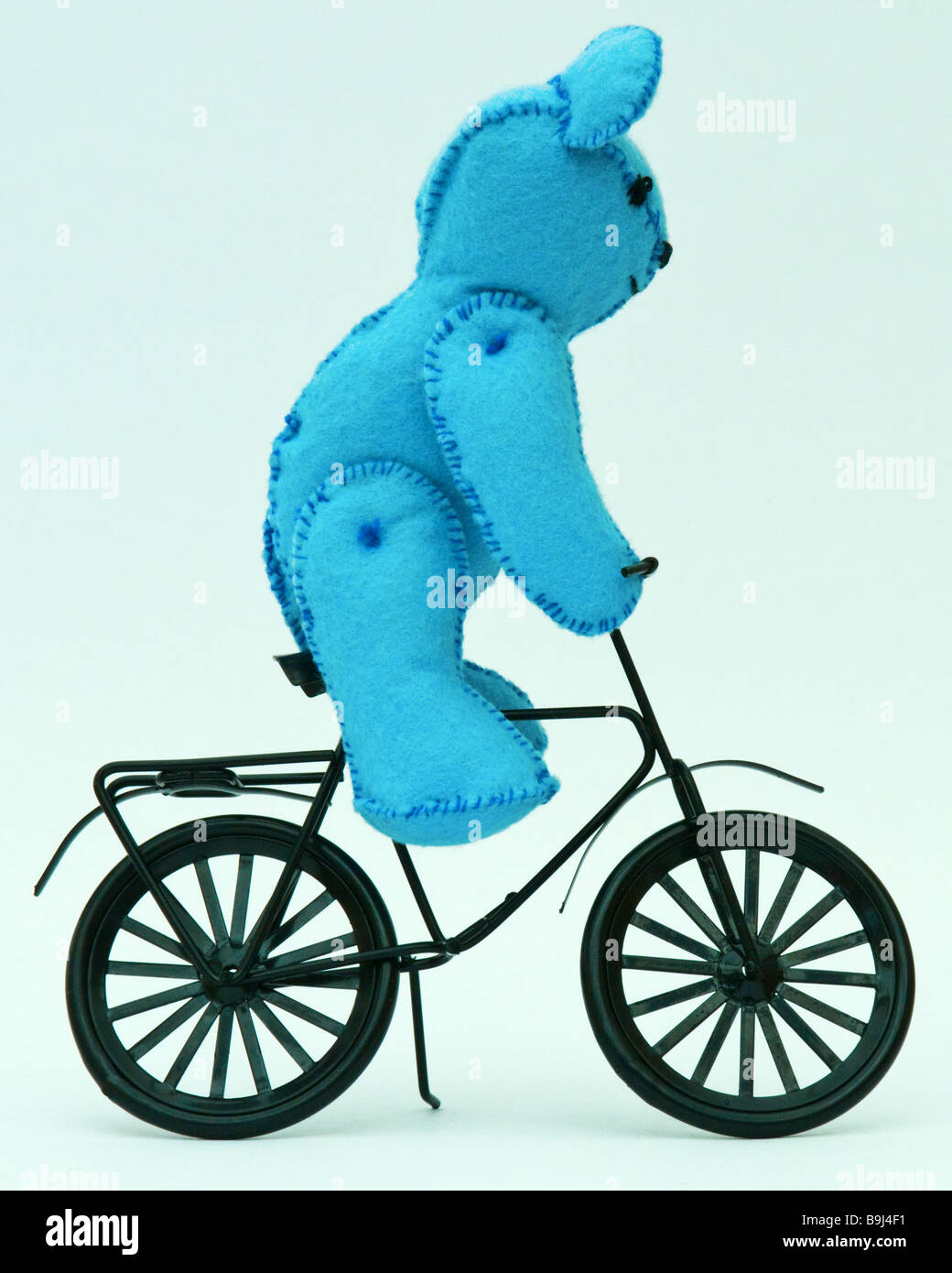 Miniature teddy bear riding bike hi-res stock photography and images ...