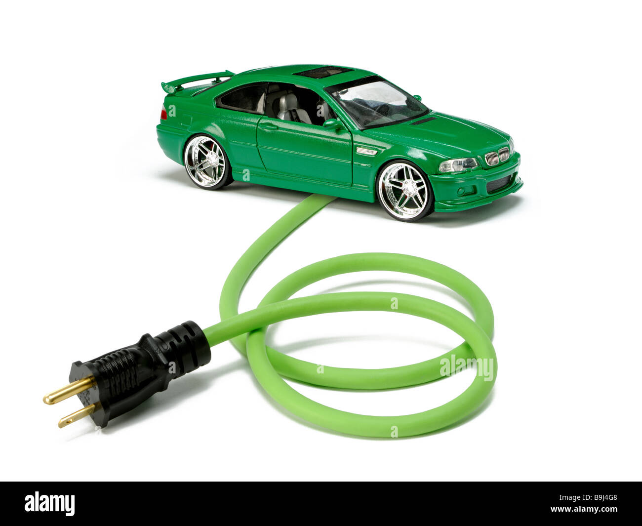 A green automobile vehicle car with a green electrical extension power ...