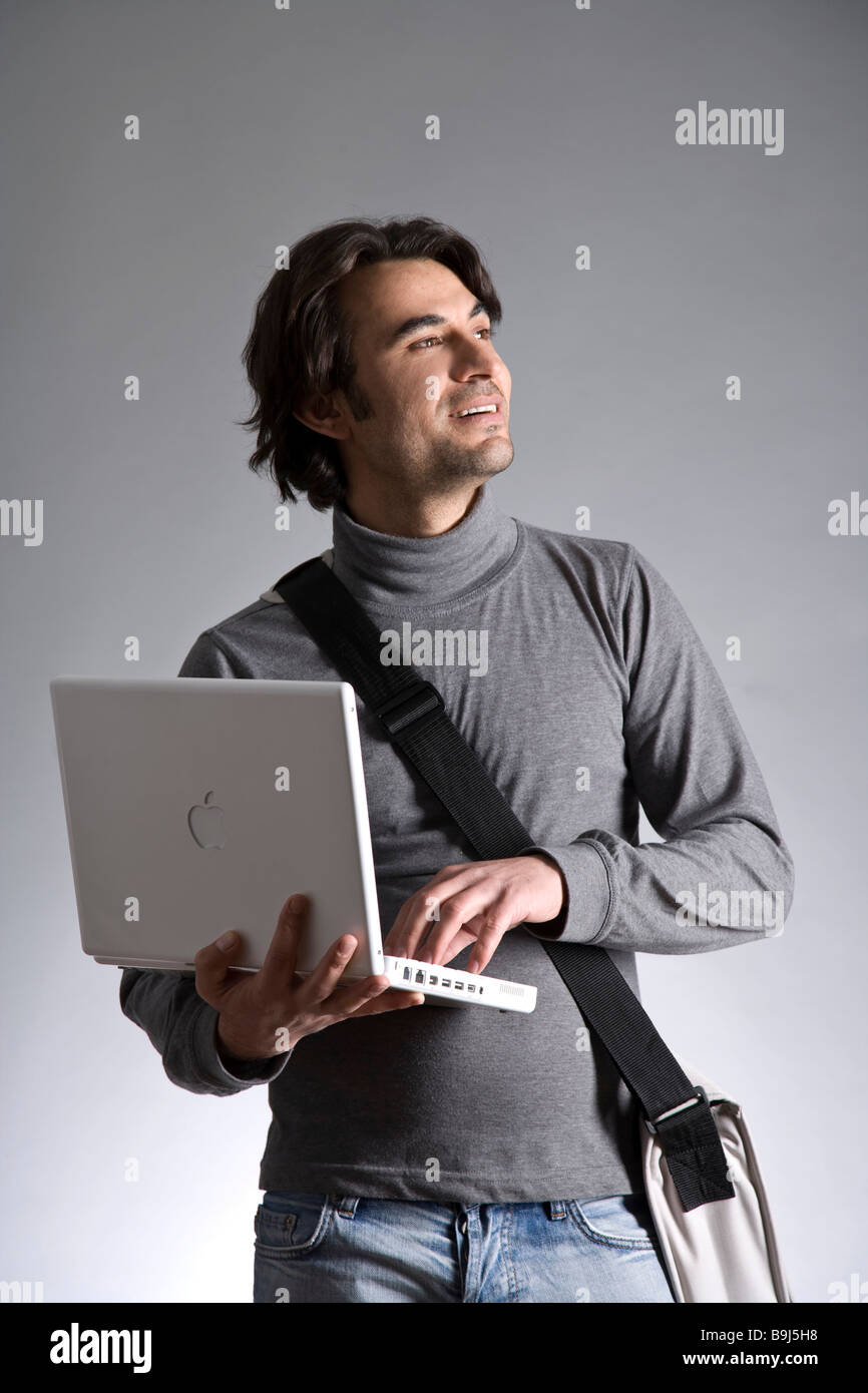 Man Carrying Laptop Bag Stock Photos & Man Carrying Laptop Bag Stock ...