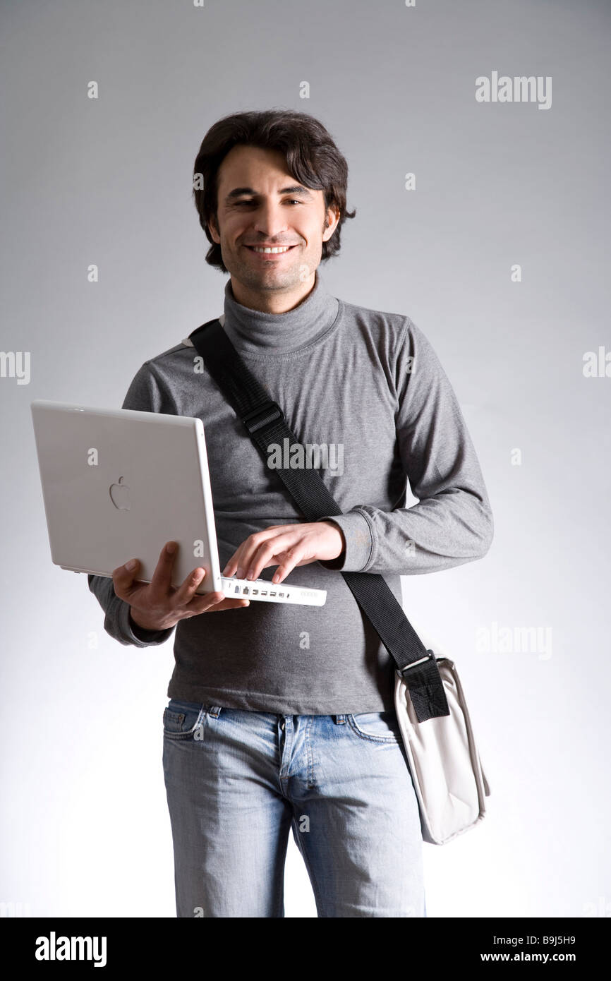 Carrying laptop bags hi-res stock photography and images - Alamy