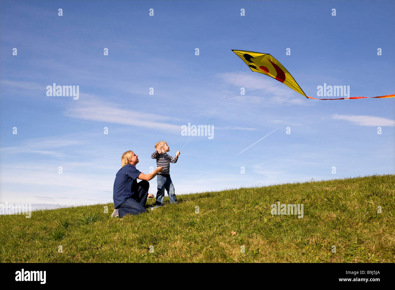 Boy and father fly a Kite Stock Photo - Alamy