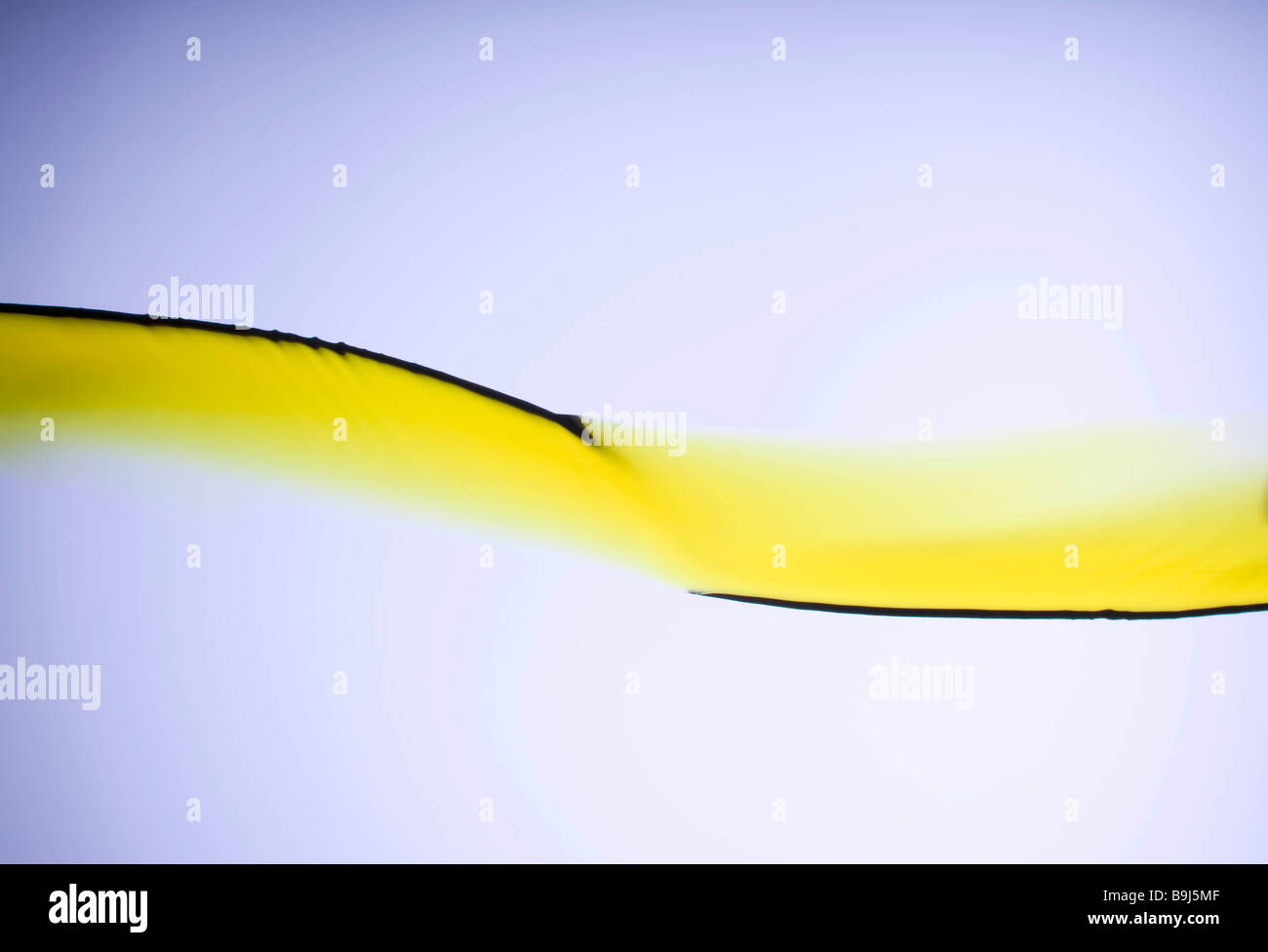 Close up of yellow water stream Stock Photo - Alamy