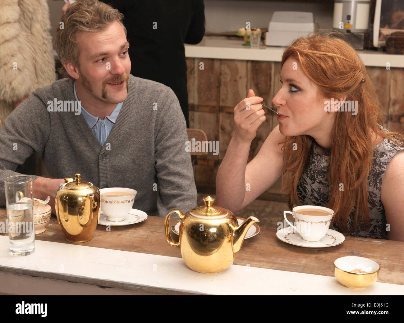 Couple having tea in café Stock Photo - Alamy