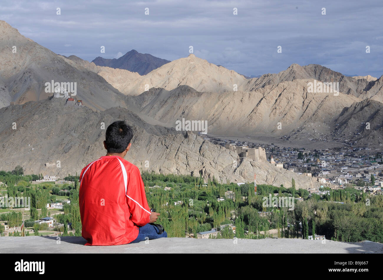 Ladakhi boy looking at the city and the Leh oasis with the Gonkhang ...