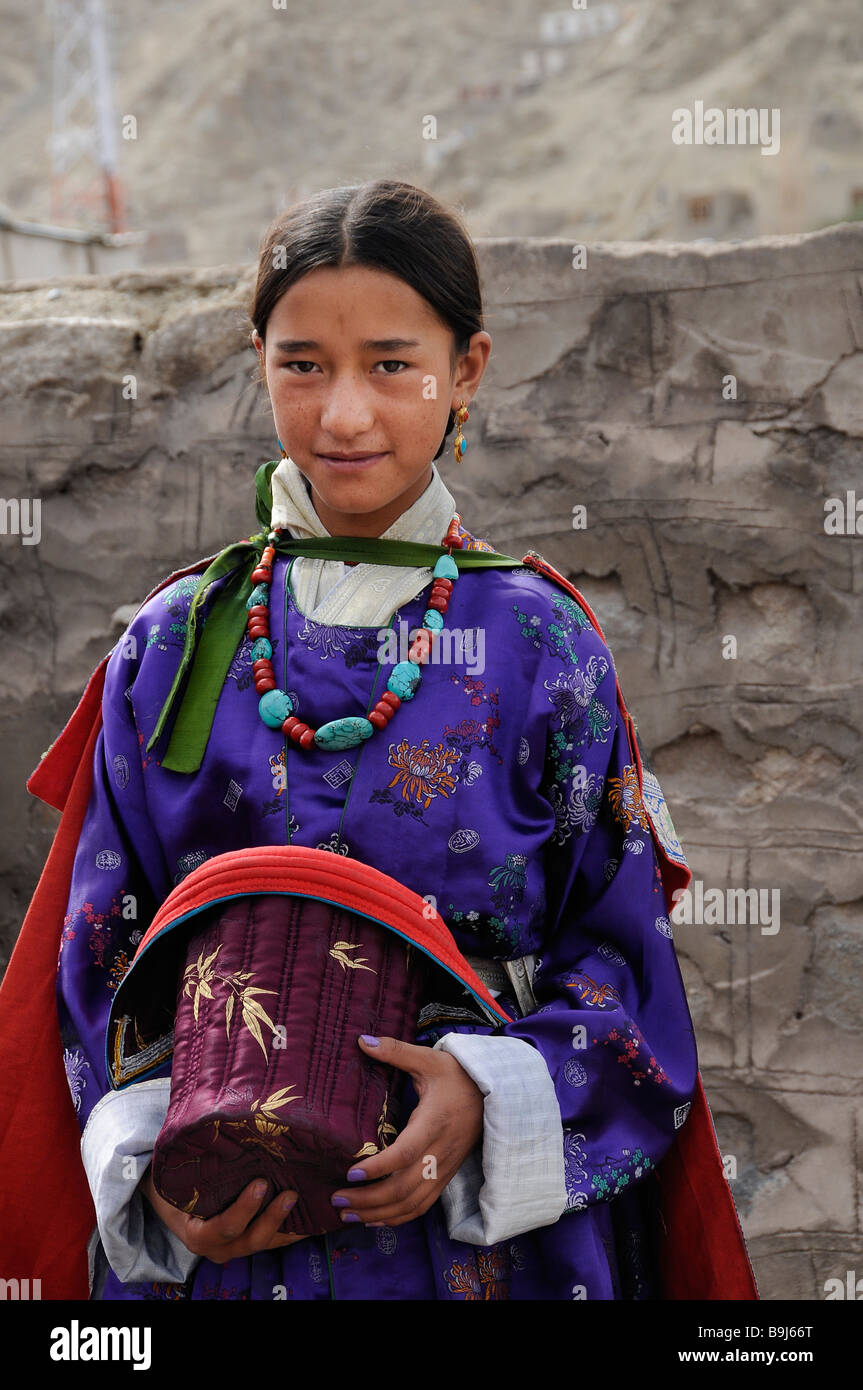 Ladakhi woman in traditional velvet clothes, turquoise jewelry and ...
