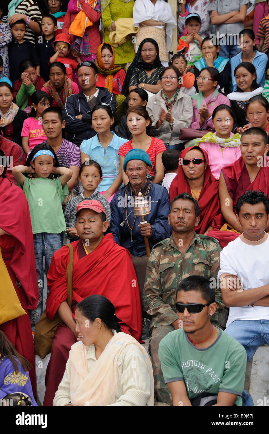 Ladakhi people wearing traditional costumes with a prayer wheel, Leh ...
