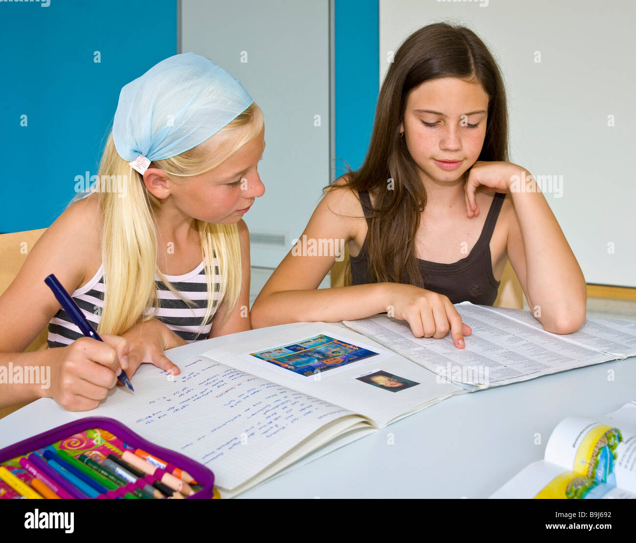 Two girls, eleven years, doing their homework together Stock Photo - Alamy
