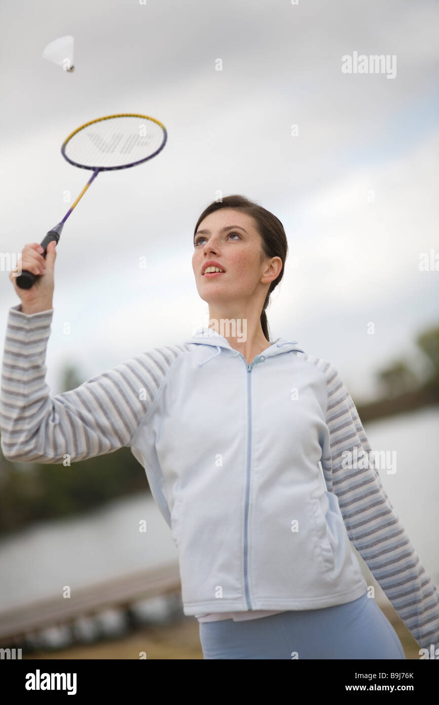 Young woman playing badminton Stock Photo - Alamy