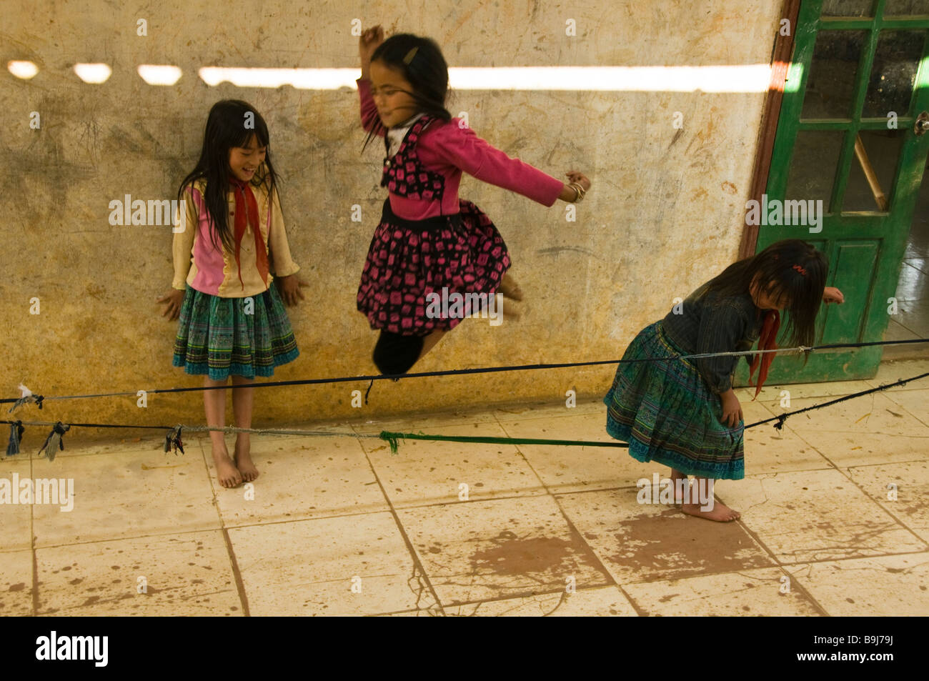 Black Hmong girls jumping rope in Sapa Vietnam Stock Photo - Alamy
