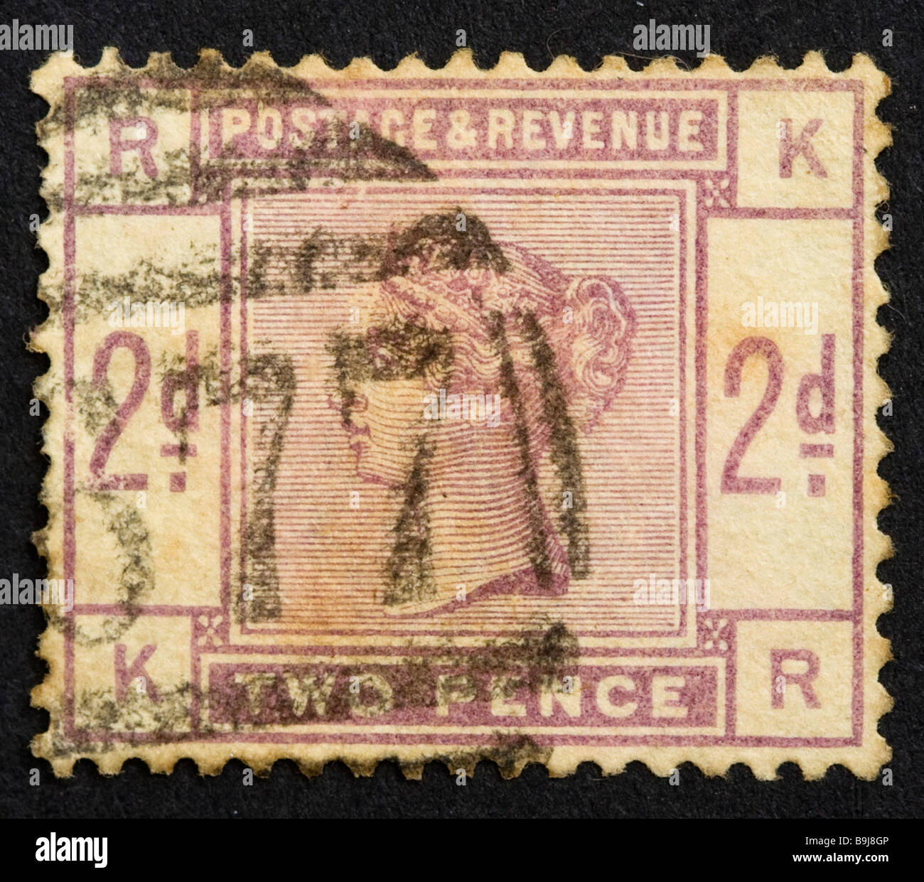 Close up of 2d, lilac Victorian British Postal stamp on black ...