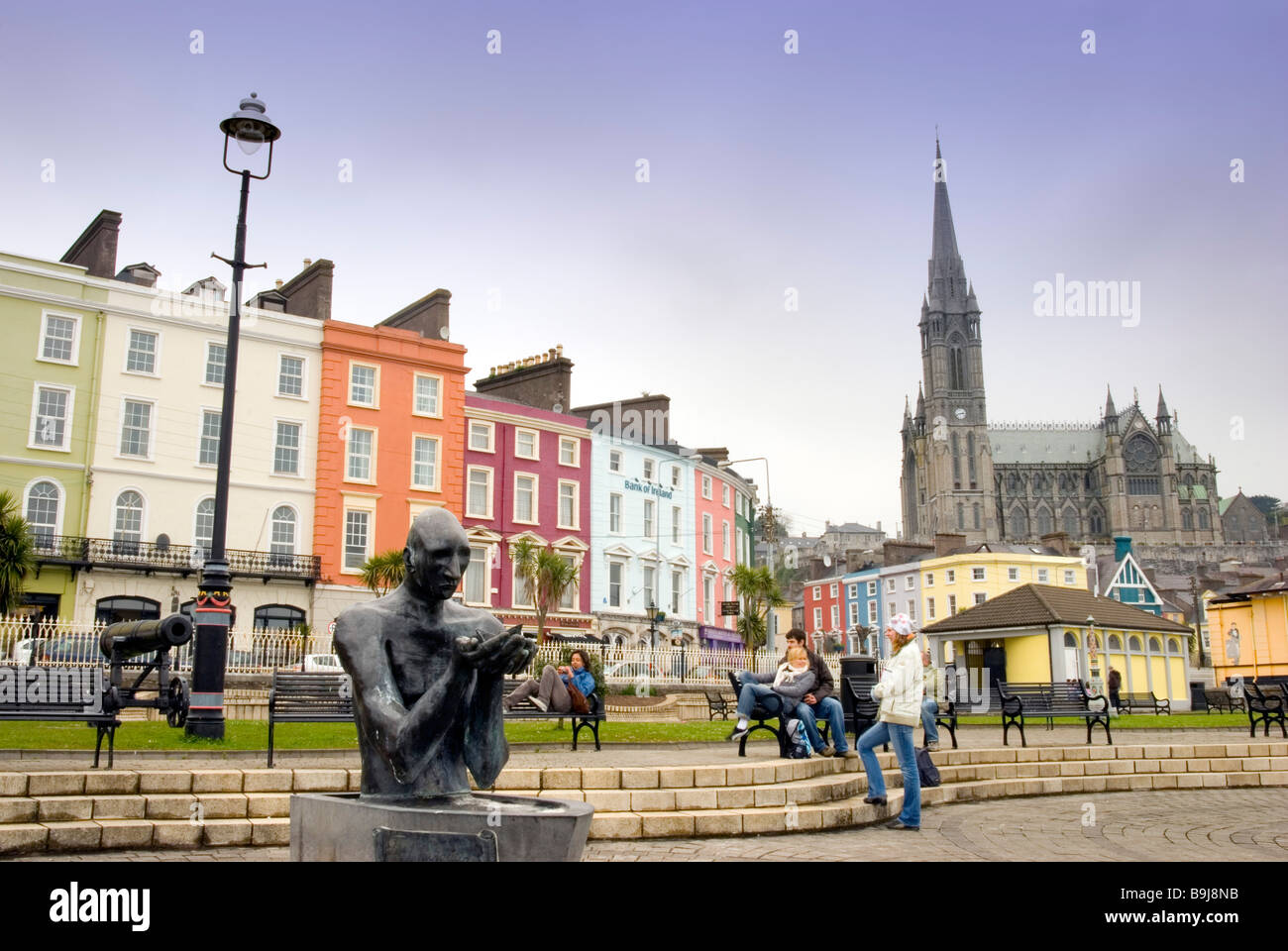 The navigator statue and Cobh waterfront with St. Colman's Cathedral in ...