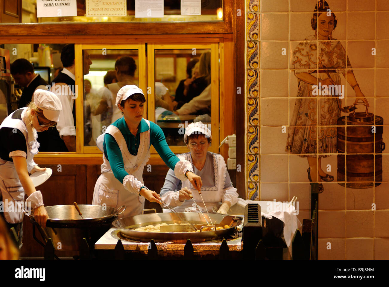 People cooking Spanish donuts Buñuelos traditionally eaten during Las ...